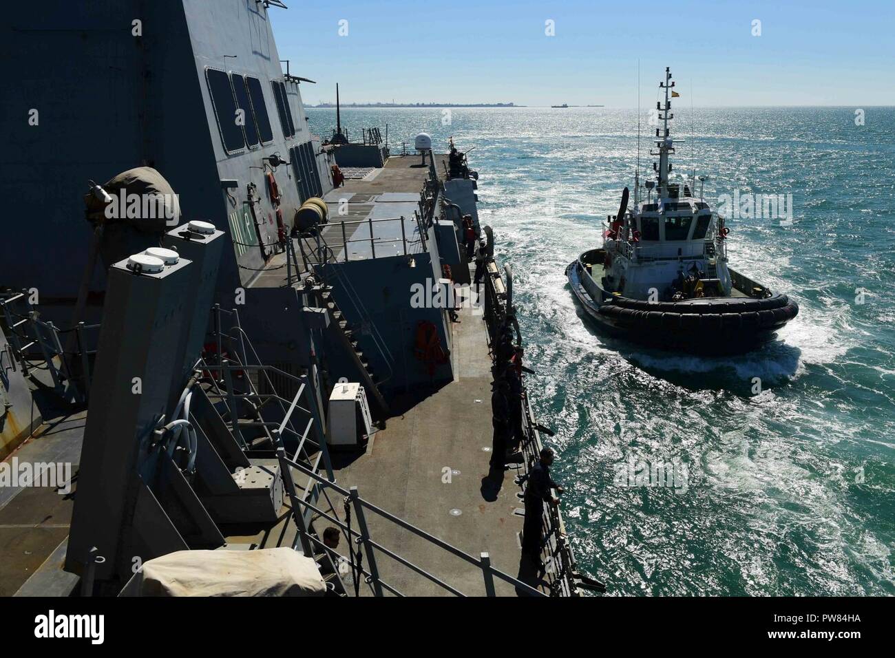 NAVAL STATION ROTA, Spain (Oct. 3, 2017) - A tug boat sails alongside ...