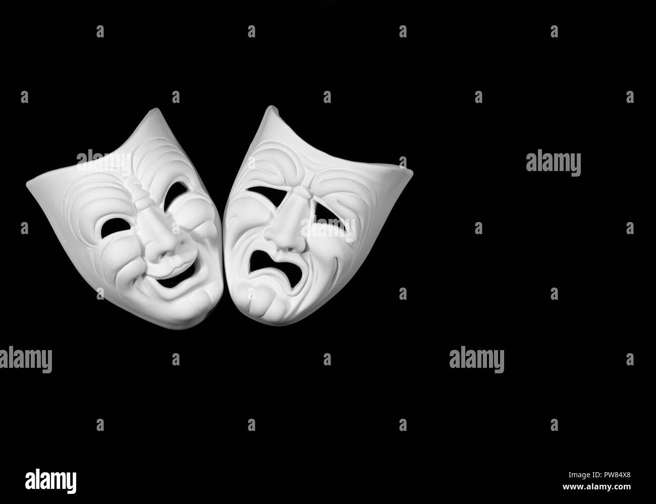 theatre mask expresing the tragedy and the comedy, white mask on black ...