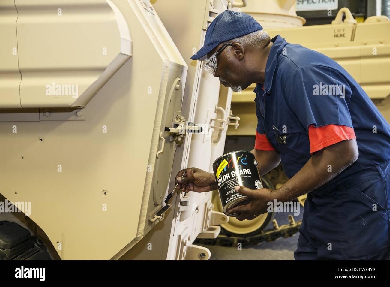 Percy Welch applies color guard to a M113A3/BMP-2 Opposing Forces ...