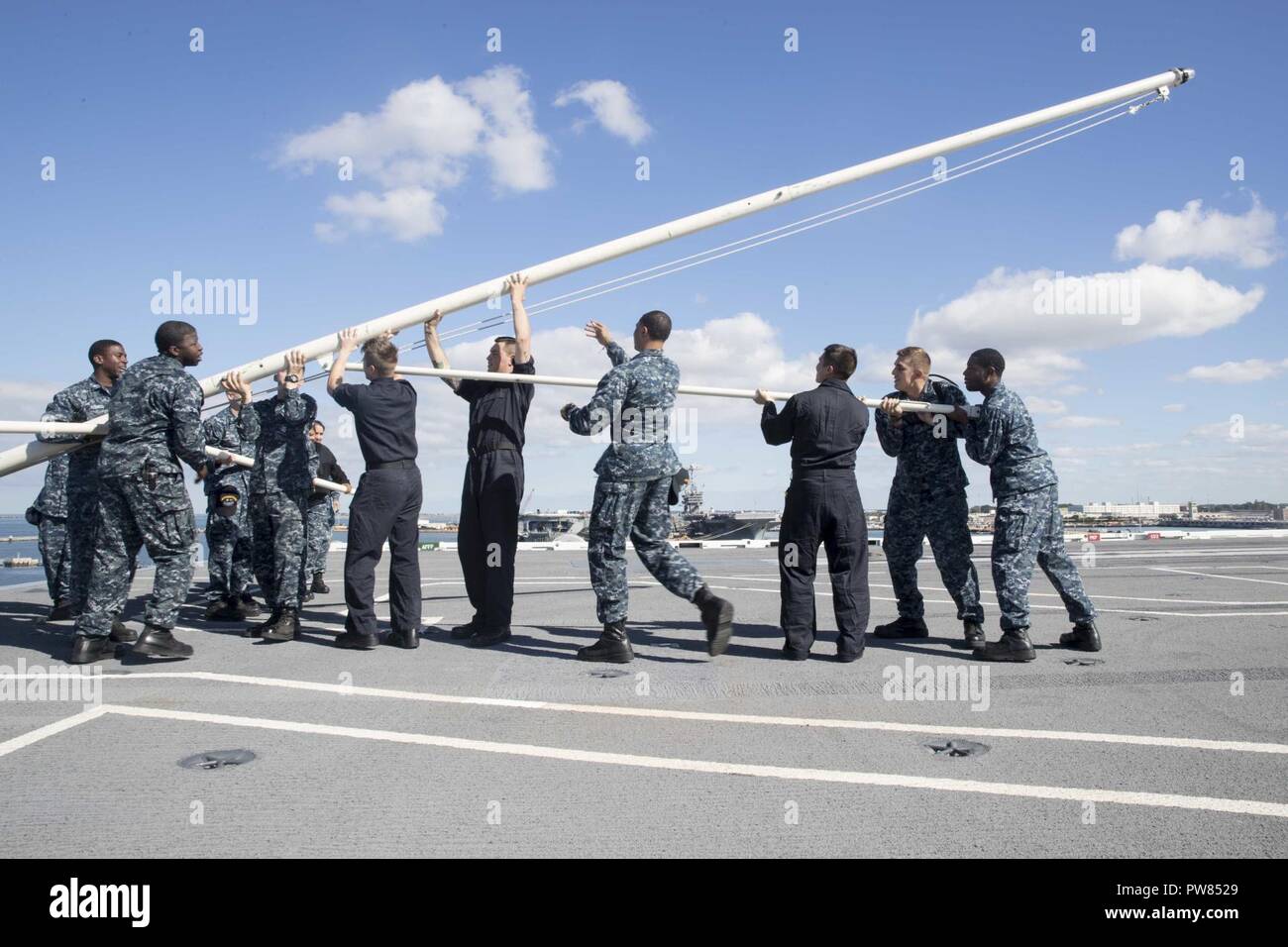 NORFOLK (Oct. 2, 2017) Sailors disassemble the jack staff on the flight ...