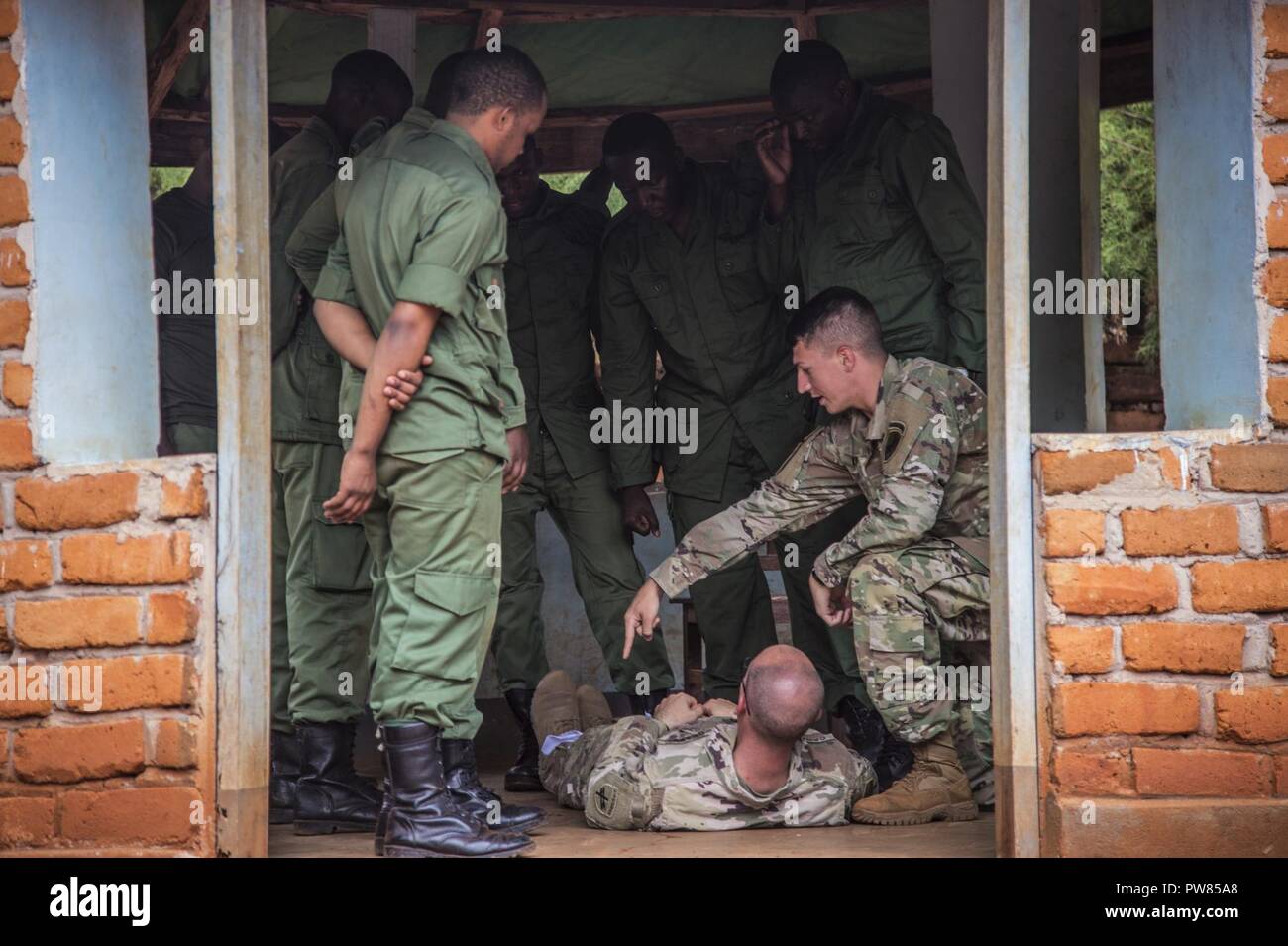 Staff Sgt. Philip Canafax (right), a civil affairs Soldier with ...