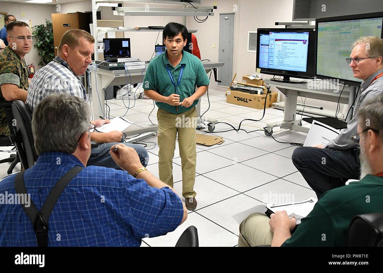 Paul Pham (center), a computer engineer with Marine Corps Tactical ...