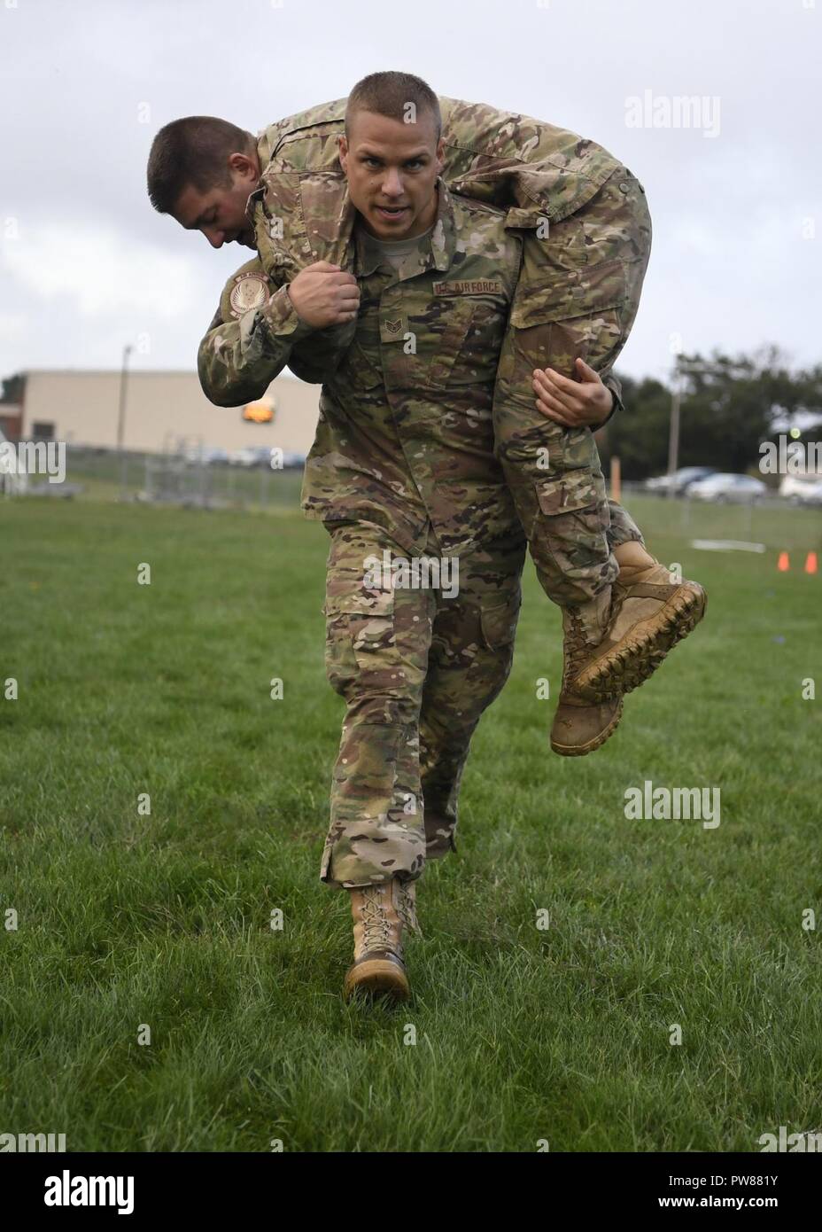 U.S. Air Force Staff Sgt. Richard Arnold carries U.S. Air Force Staff ...