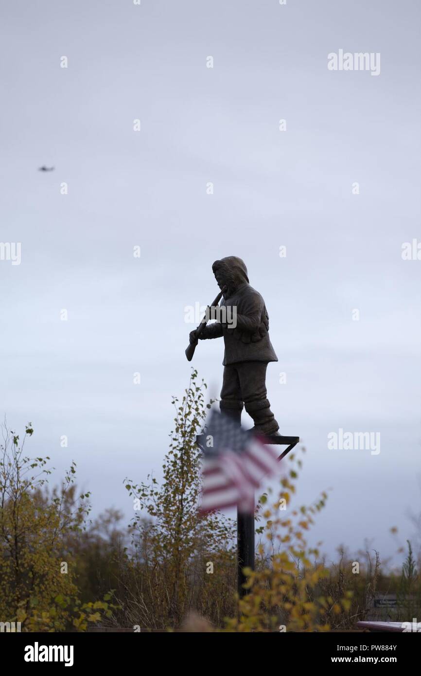 A bronze statute stands, ever watchful, on a steel pedestal at the ...