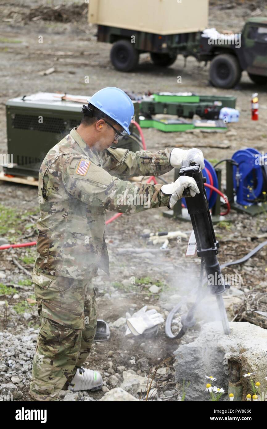 Alaska Army National Guard Sgt. Kin Shaw, a wheeled vehicle mechanic ...