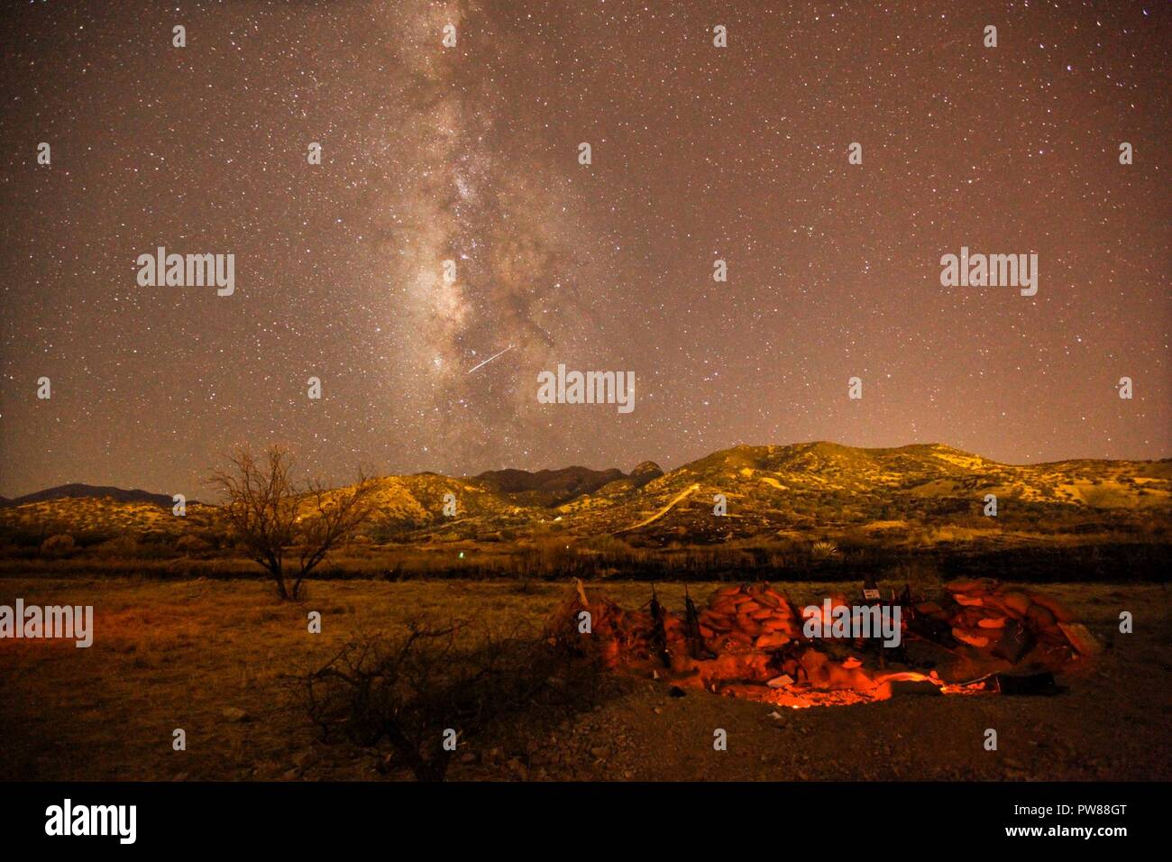 Alpha Company, 40th Expeditionary Signal Battalion conducts a live fire ...