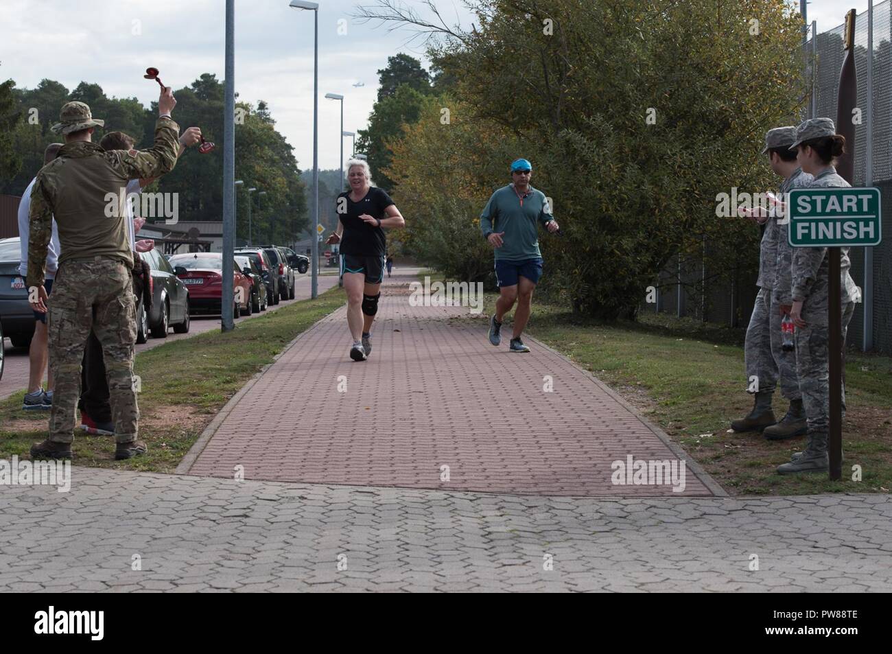 Members of the Kaiserslautern Military Community cross the finish line ...