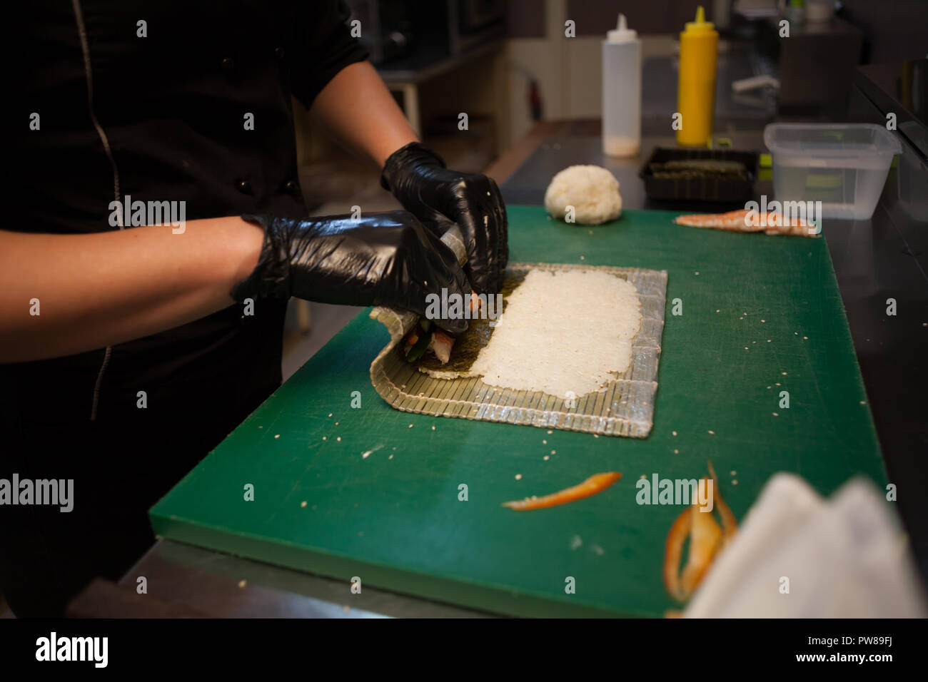 woman chef prepares sushi on restaurant kitchen 1 Stock Photo - Alamy