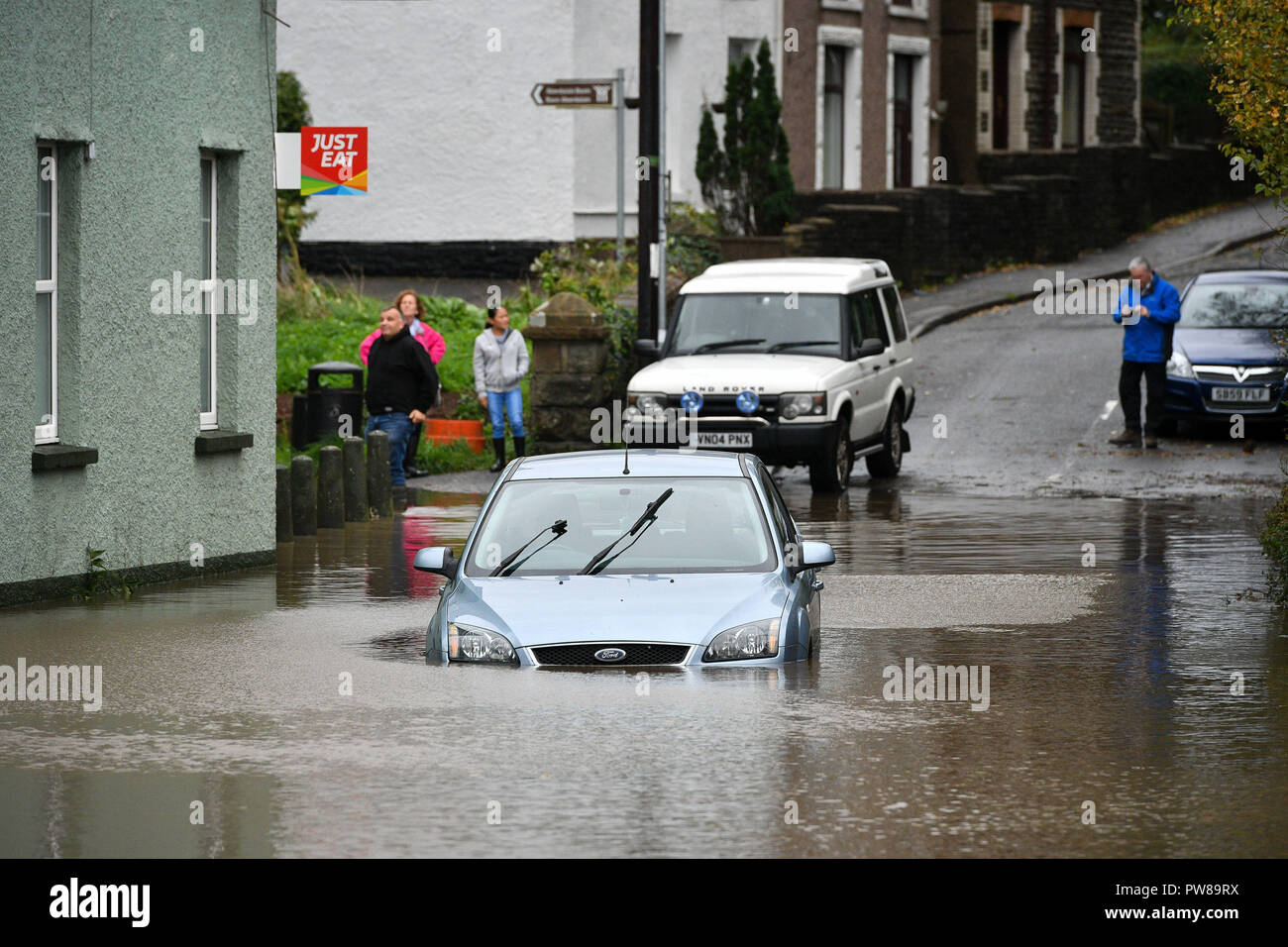 A car is stranded in floodwater in Tonna near Aberdulais, Neath, South ...