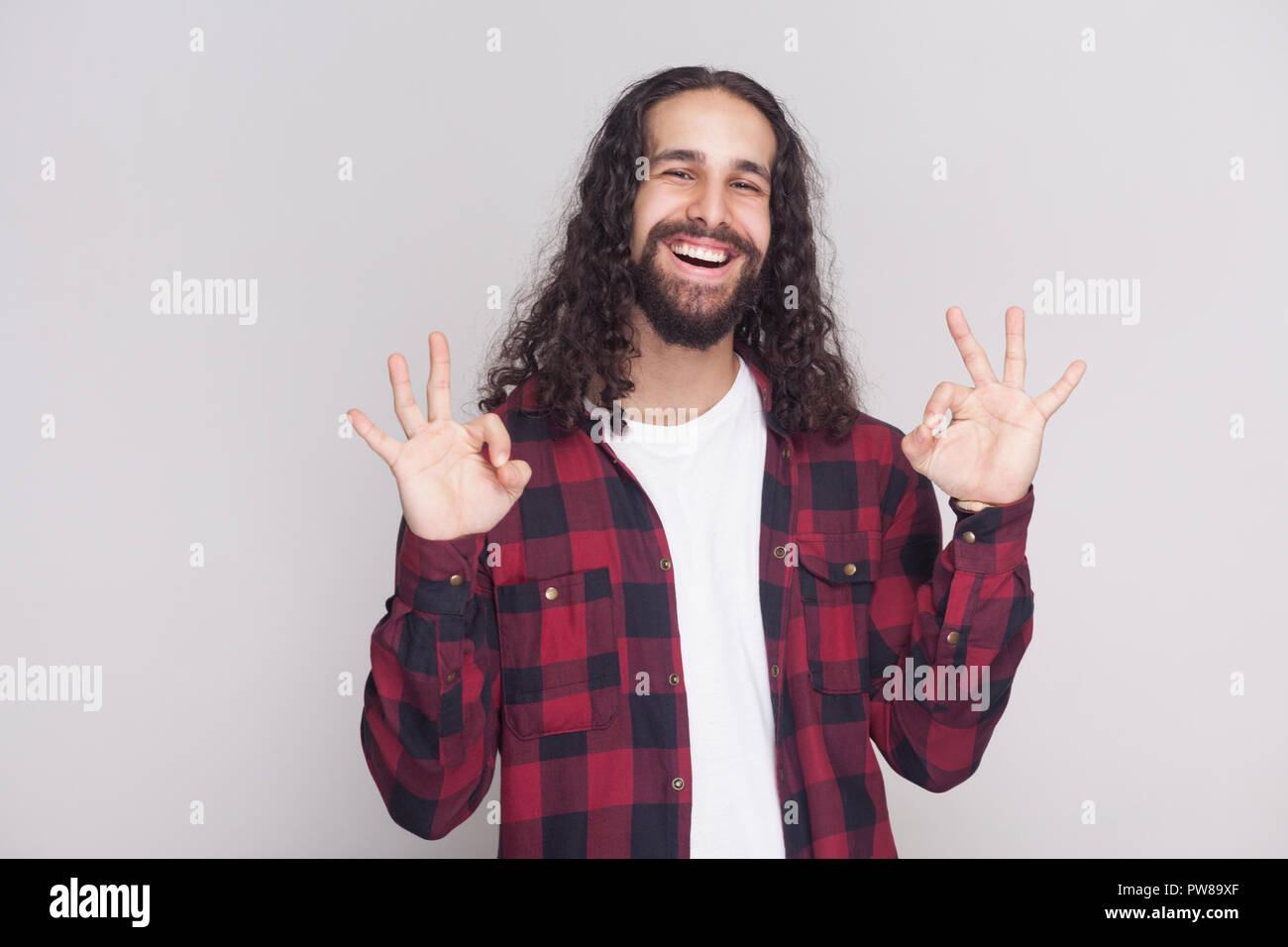 Indian man showing victory symbol hi-res stock photography and images ...