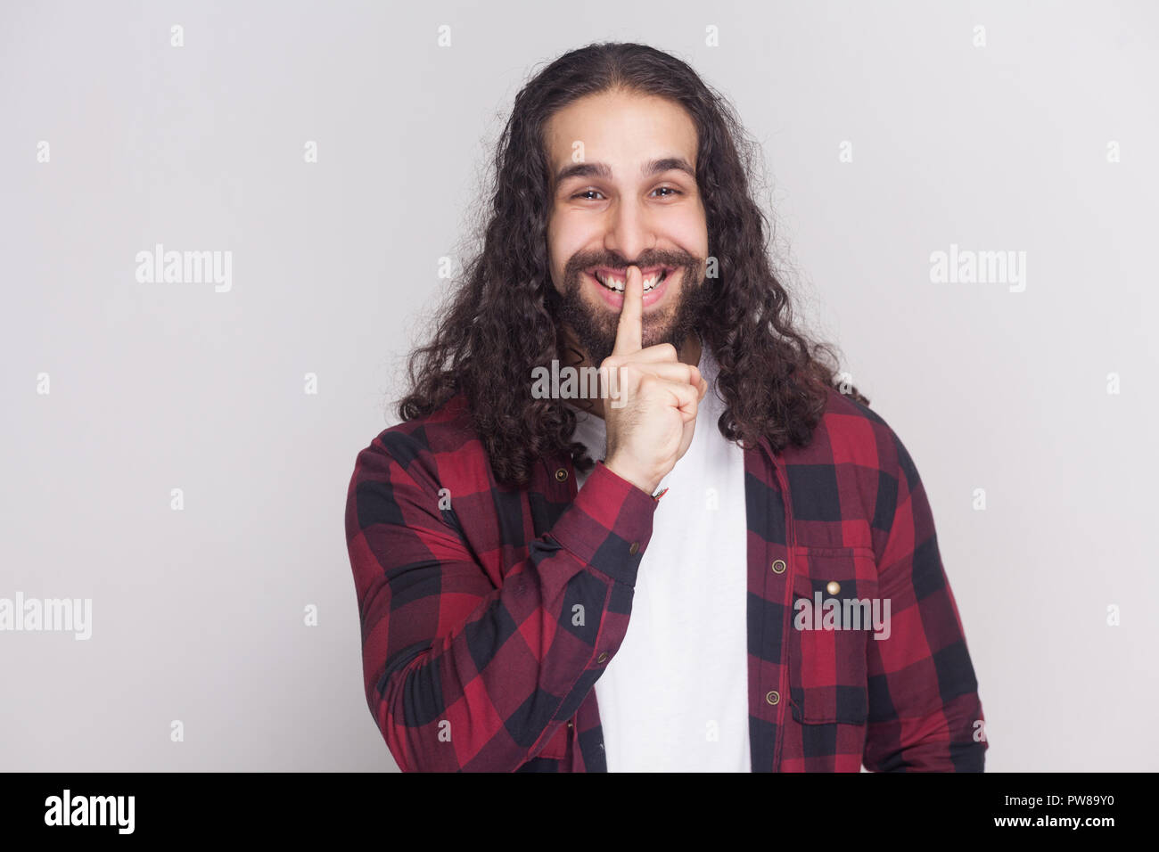 Shh, this is secret! funny man with beard and black long curly hair in ...