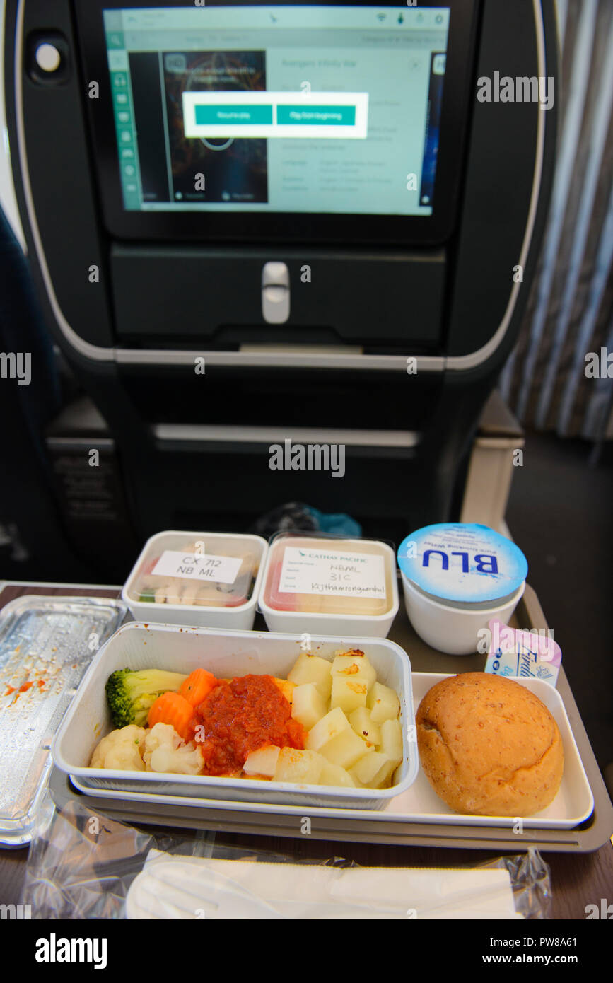 Premium economy class meal in flight Stock Photo - Alamy