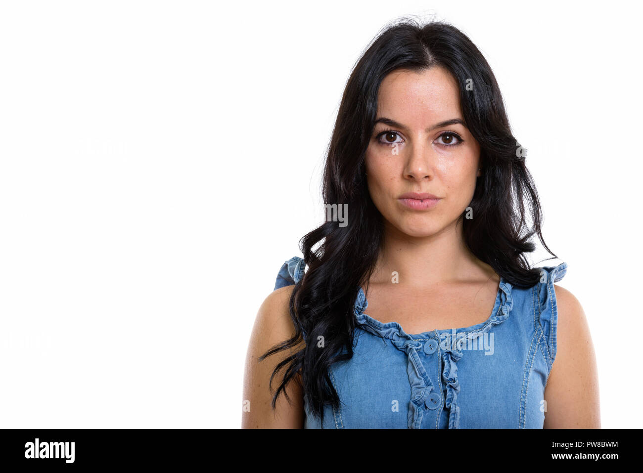 Studio shot of young beautiful Spanish woman Stock Photo - Alamy