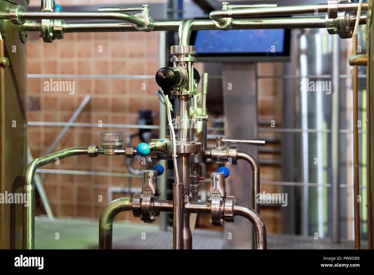 Close up of equipments in modern interior of brewery. Manufacturable ...