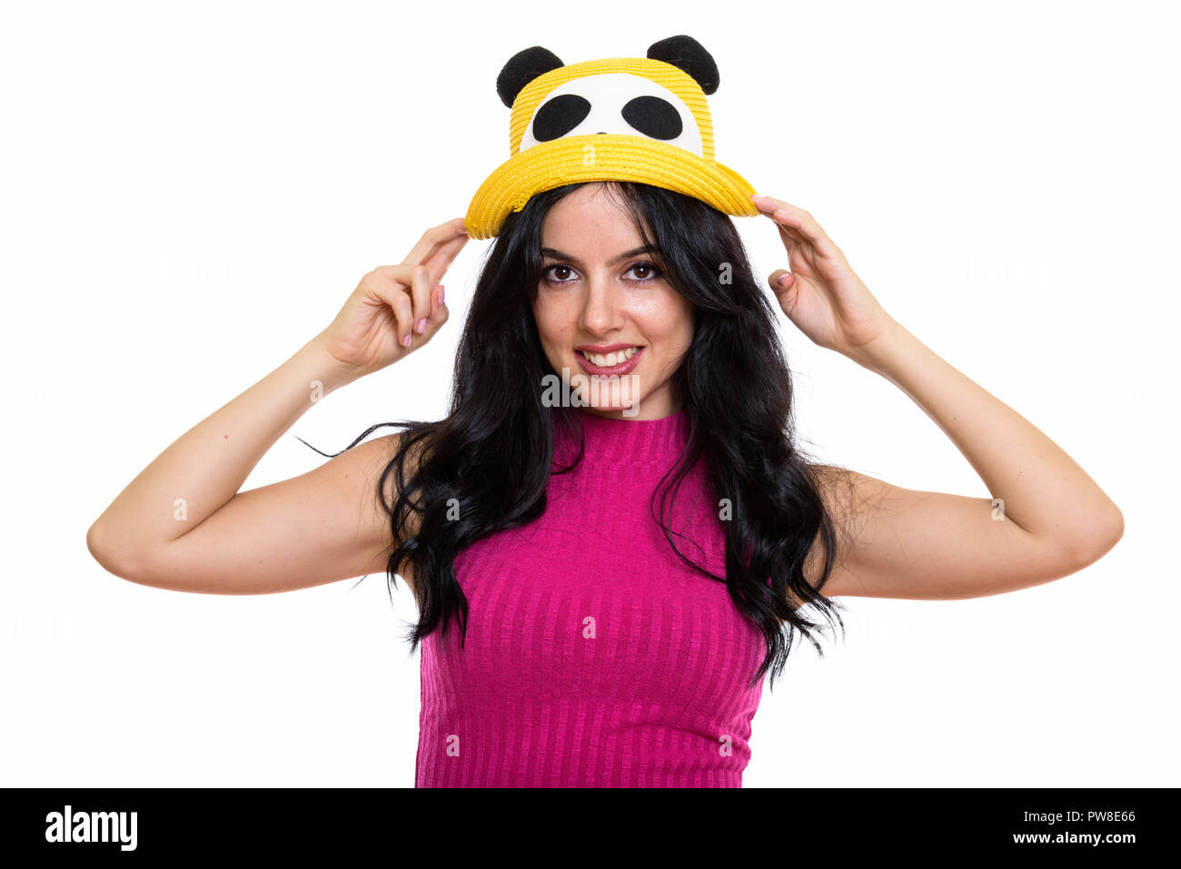 Studio shot of young happy Spanish woman smiling while holding h Stock ...