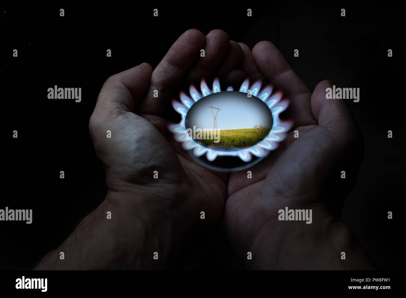 Two hands show two examples of energies: electric and methane gas Stock ...