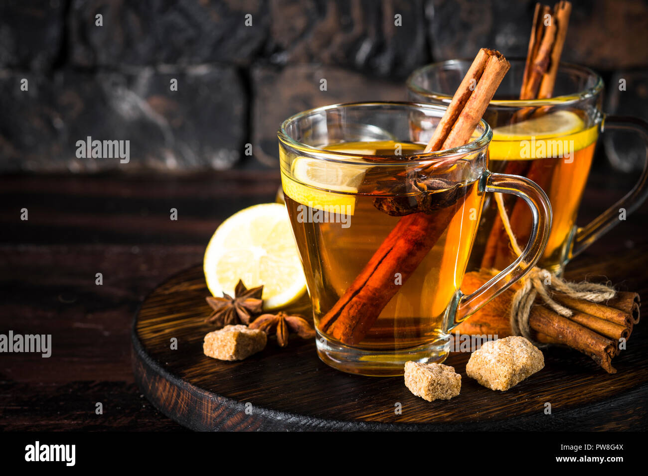Autumn hot tea with lemon and spices Stock Photo - Alamy