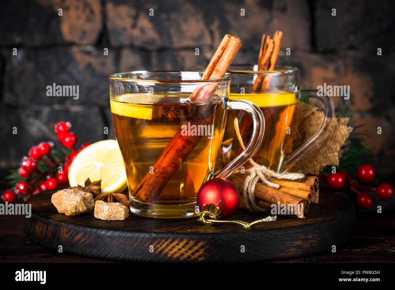 Christmas drink with lemon and spices Stock Photo - Alamy