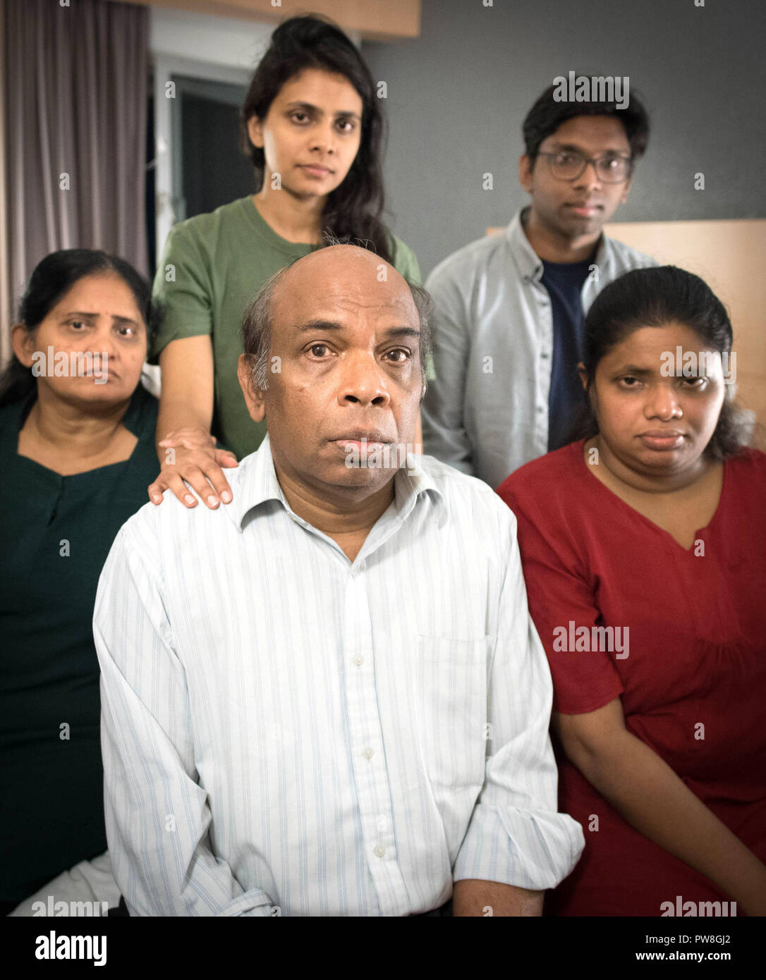 Sangarapillai Balachandran, 60 (centre) with his wife Shanthy (left ...