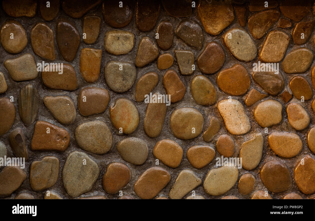 Wall round stone rock texture and seamless background Stock Photo - Alamy