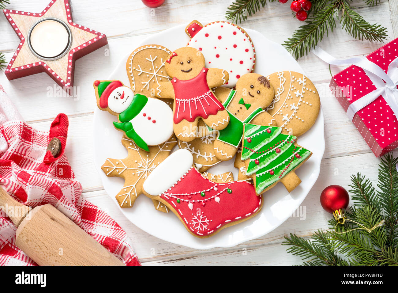 Christmas gingerbread in the plate on white. Top view Stock Photo - Alamy
