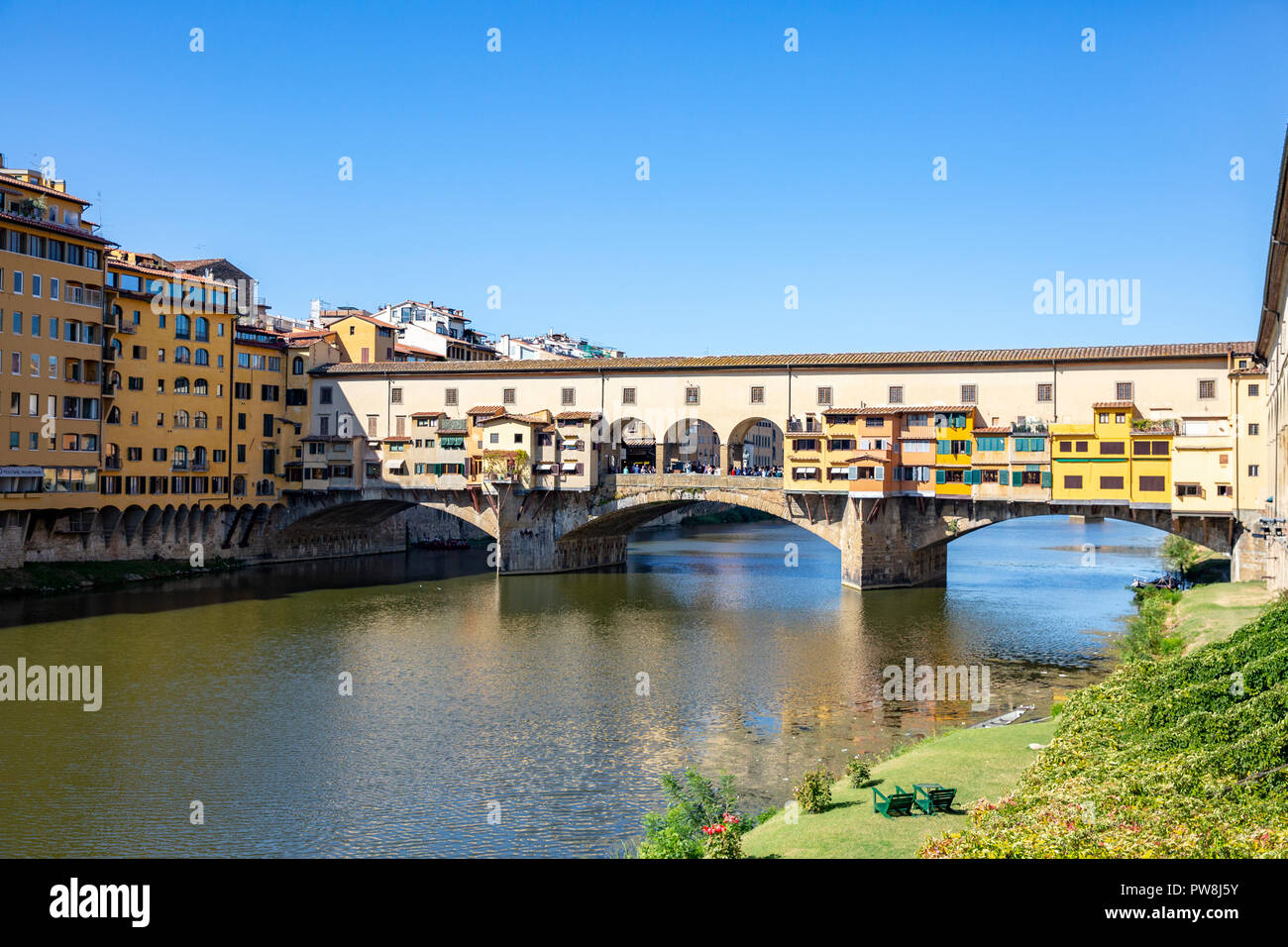Ponte Vecchio medieval arch bridge across the river Arno in Florence ...