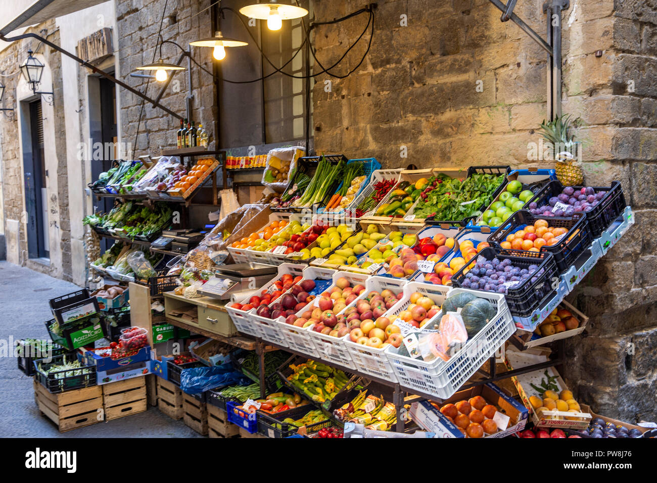 Greengrocer corner stall selling fresh fruit and vegetables in Florence ...