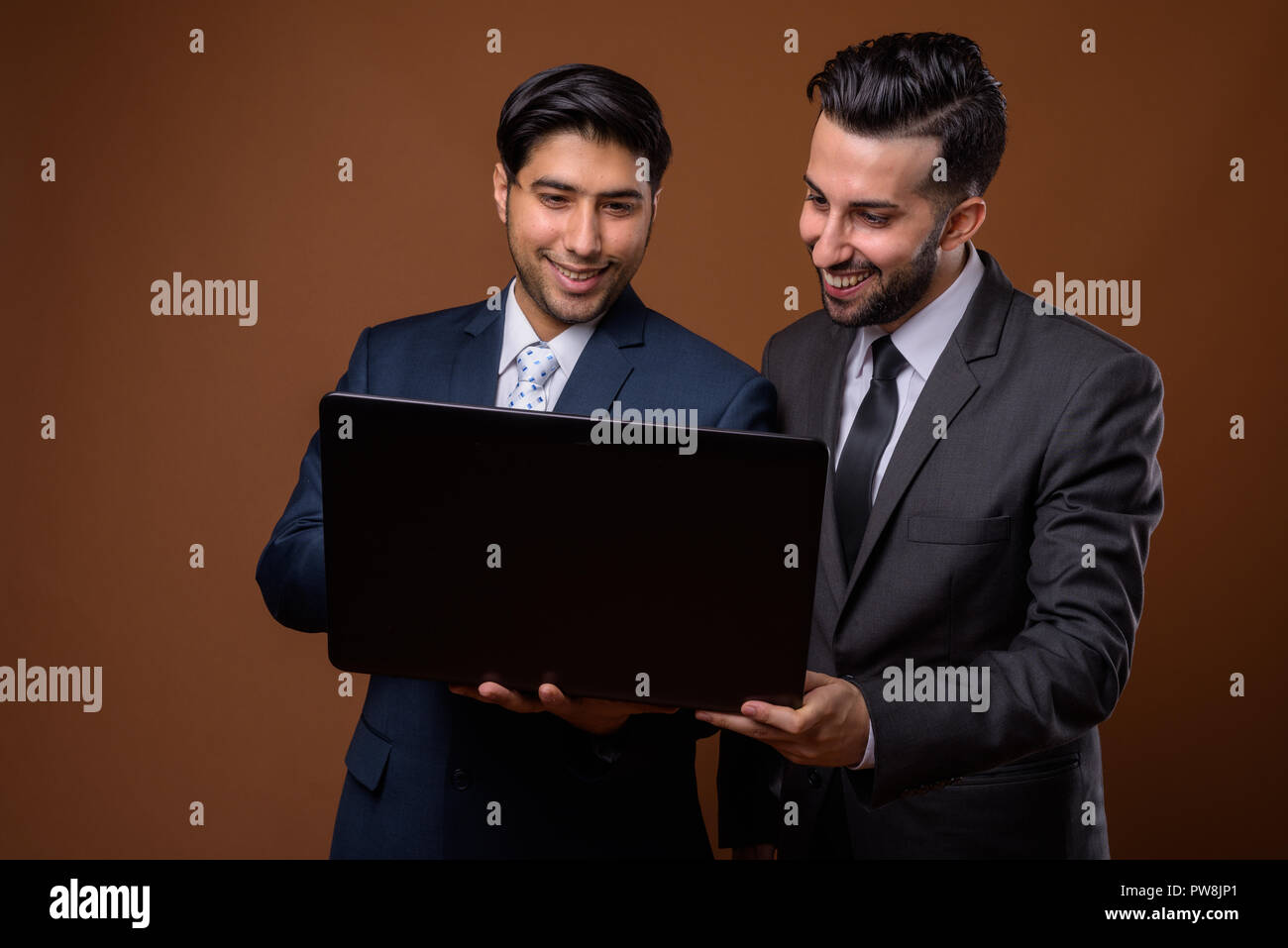 Two men laptop computer smiling hi-res stock photography and images - Alamy