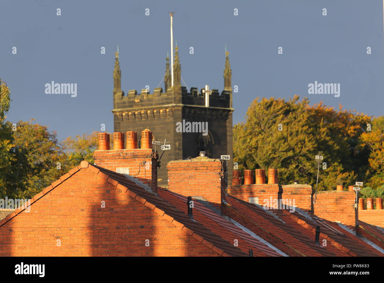 A view of St Mary's Church in Swillington with chimneys from terraced ...