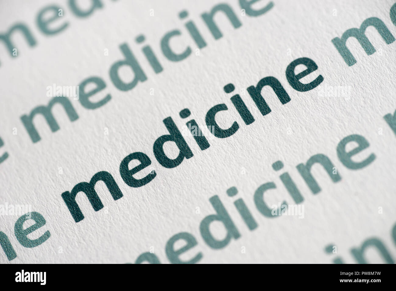word medicine printed on white paper macro Stock Photo - Alamy