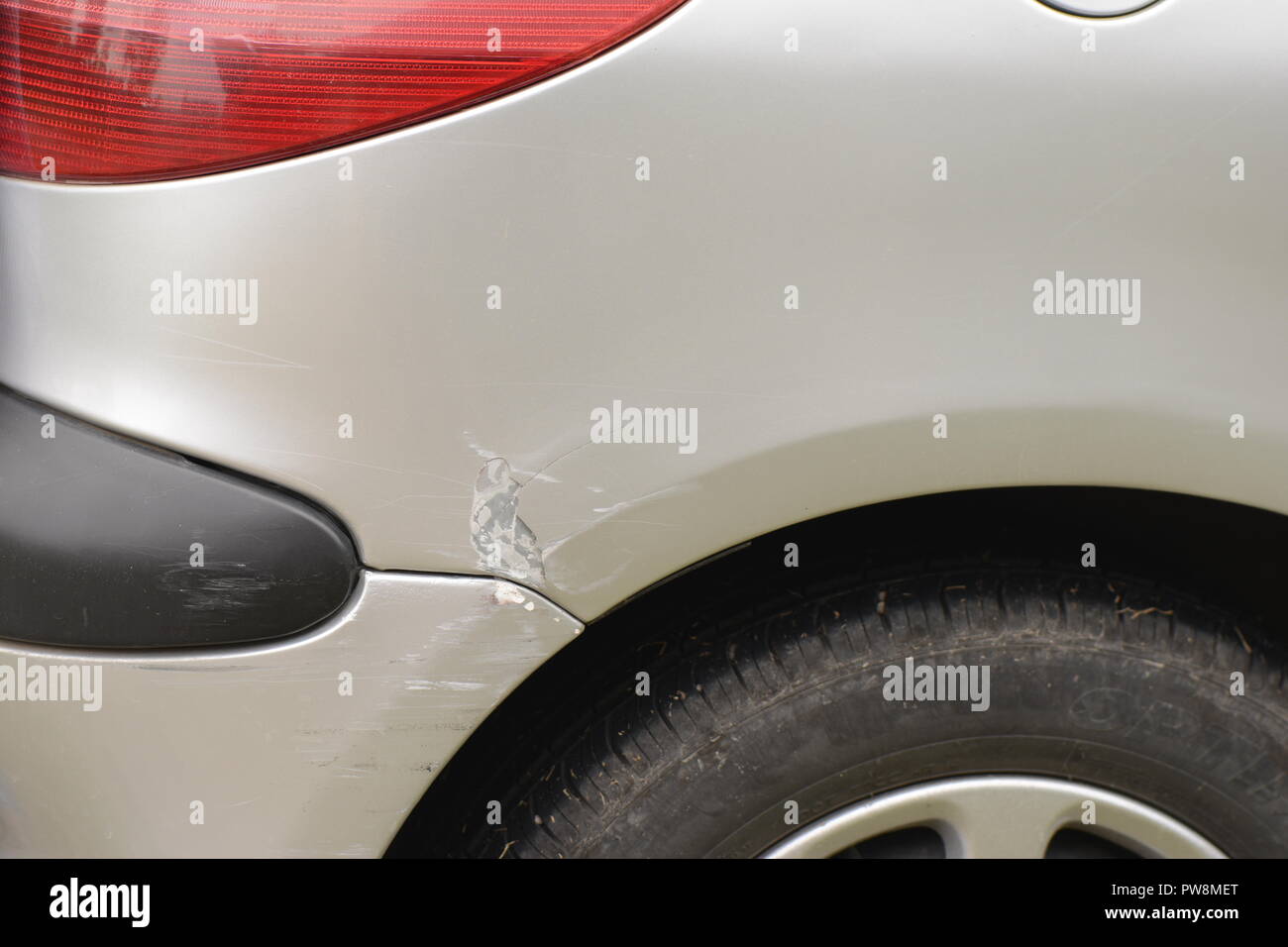 Damaged body, small crush on vehicle body, detail shot Stock Photo - Alamy