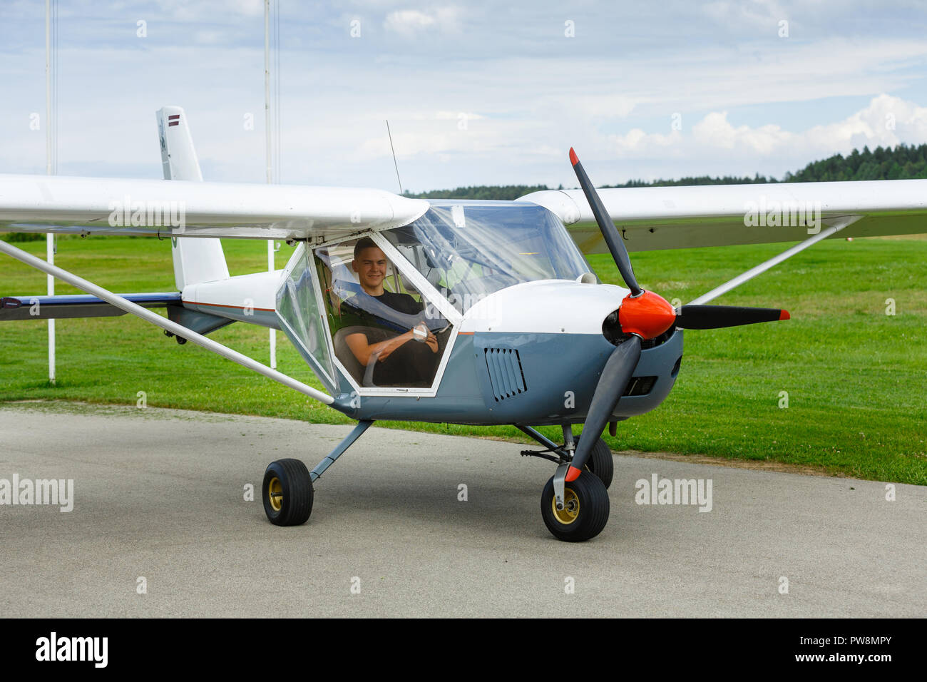 Attractive commercial pilot in cockpit hi-res stock photography and ...