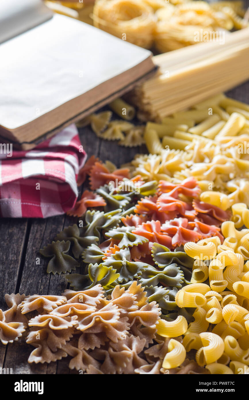 Various types of italian pasta on old wooden table Stock Photo - Alamy