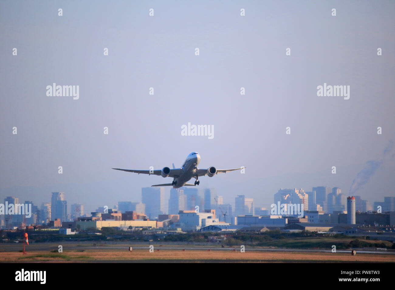 Airplane at Itami Airport Stock Photo - Alamy