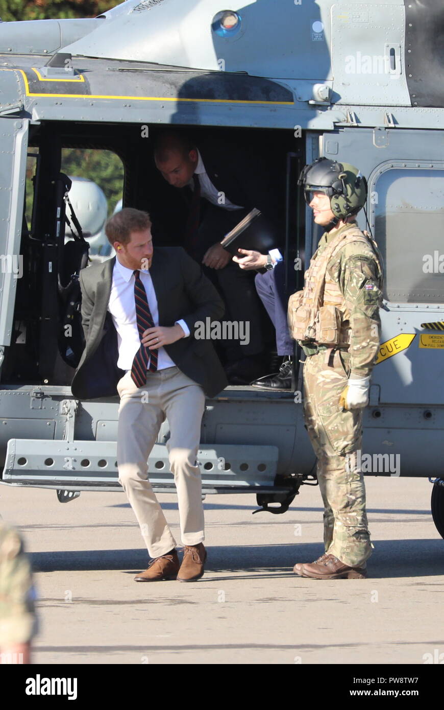 Prince Harry arrives by helicopter at Commando Training Centre Royal ...