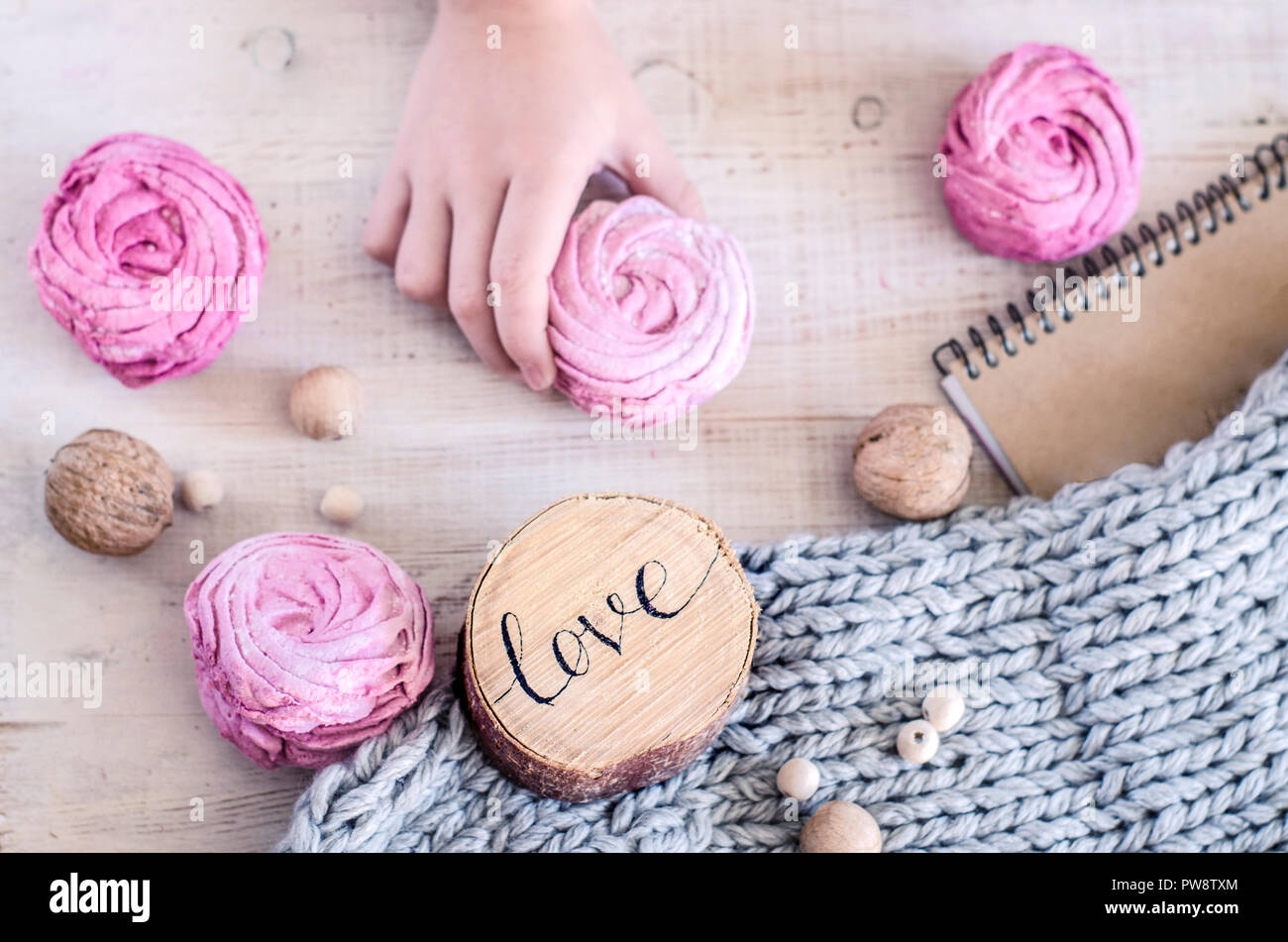 Homemade pink berry marshmallow. Composition with the inscription Love ...
