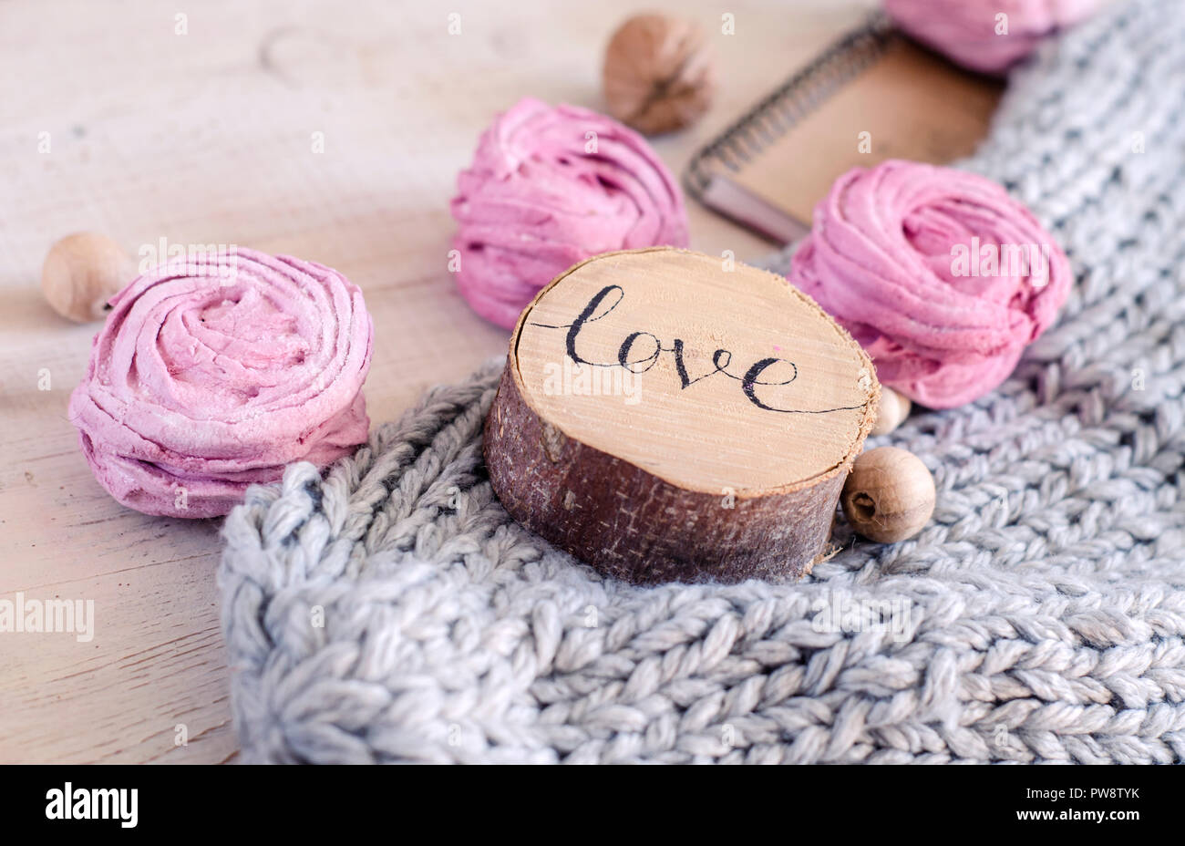 Homemade pink berry marshmallow. Composition with the inscription Love ...