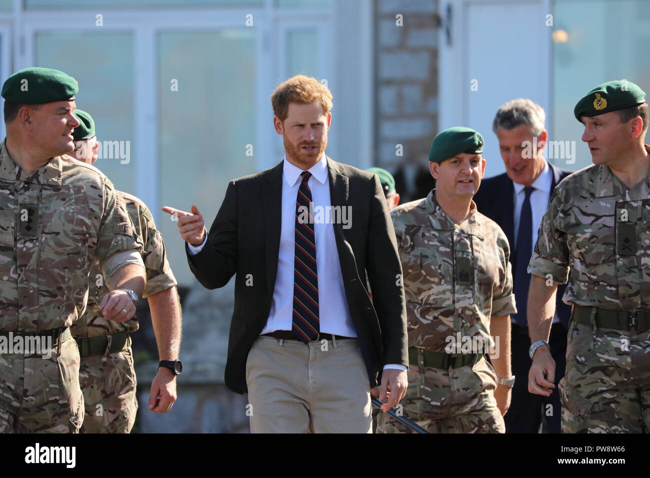 Prince Harry arrives by helicopter at Commando Training Centre Royal ...