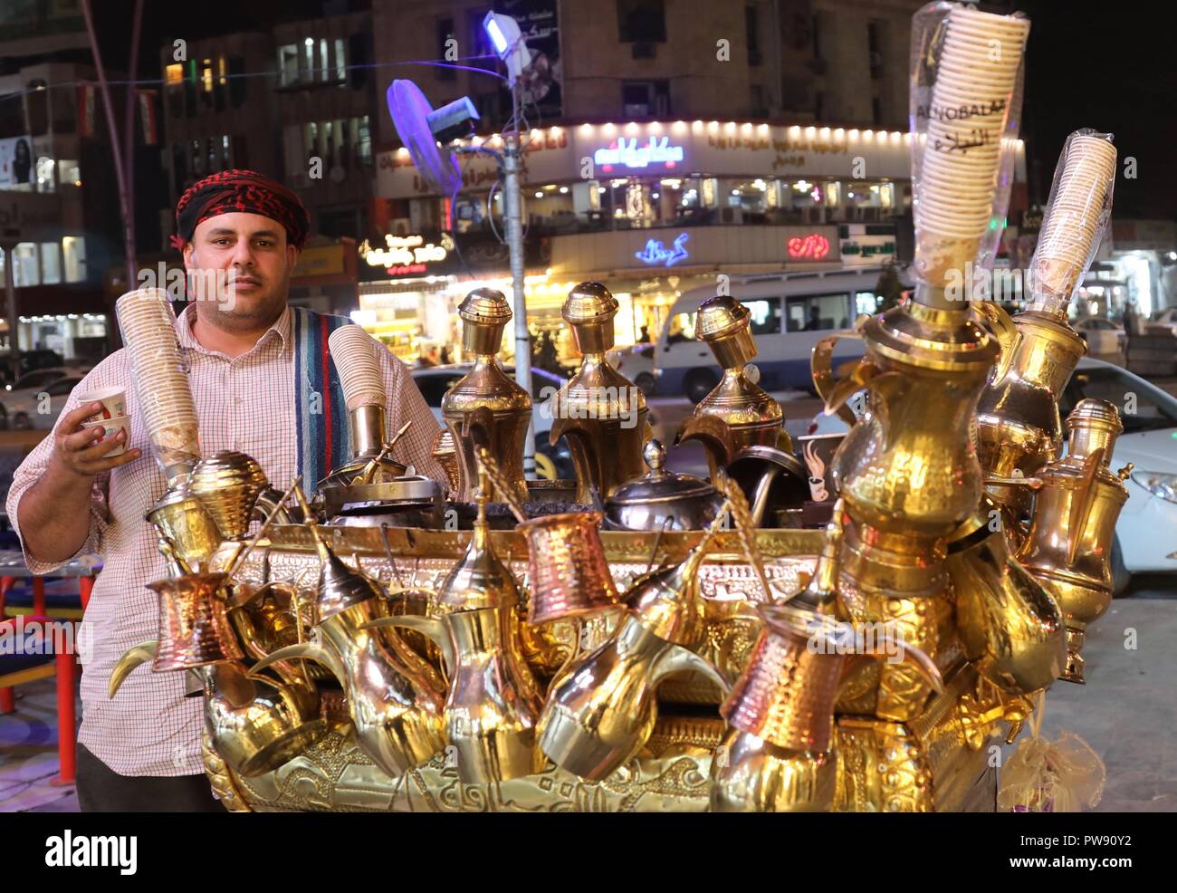 Baghdad, Iraq. 13th Oct, 2018. A street vendor sells tea in Al-Mansour ...