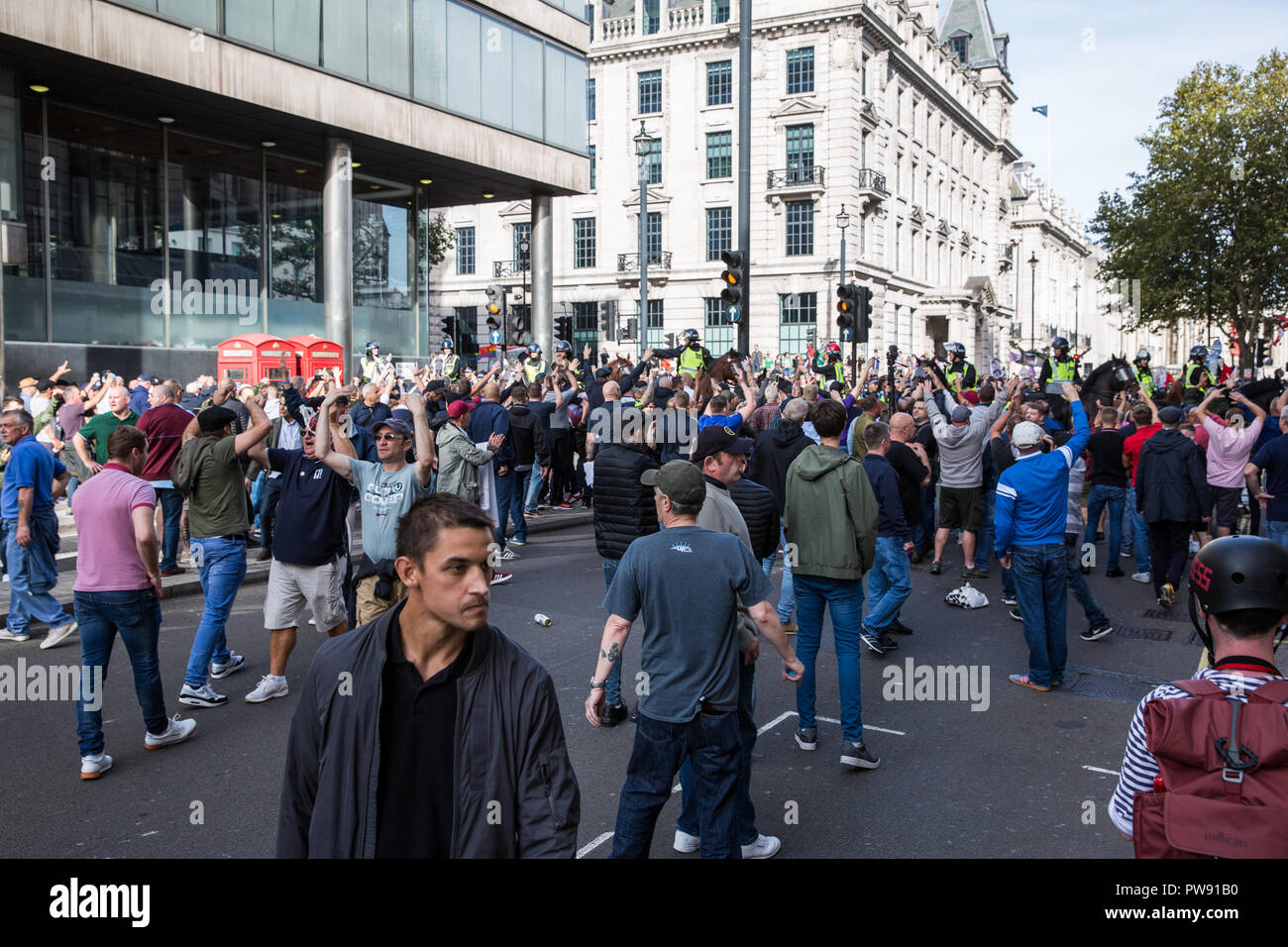 London, UK. 13th October, 2018. Mounted police officers form a line in ...