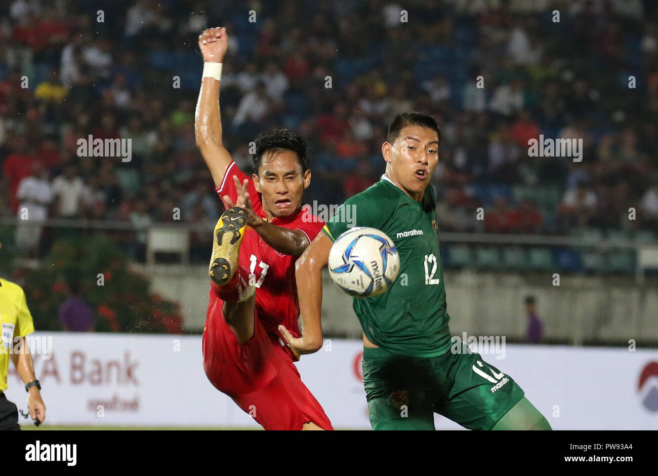 Yangon, Myanmar. 13th Oct, 2018. Myo Ko Tun (L) of Myanmar vies with ...
