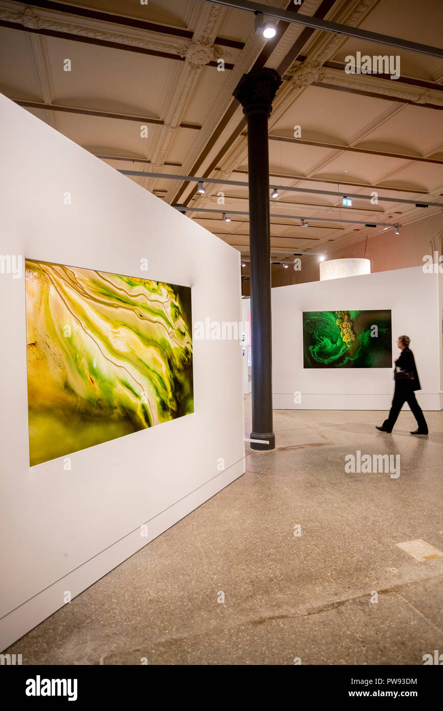 10 October 2018, Berlin: Pictures by photographer J. Henry Fair hanging ...