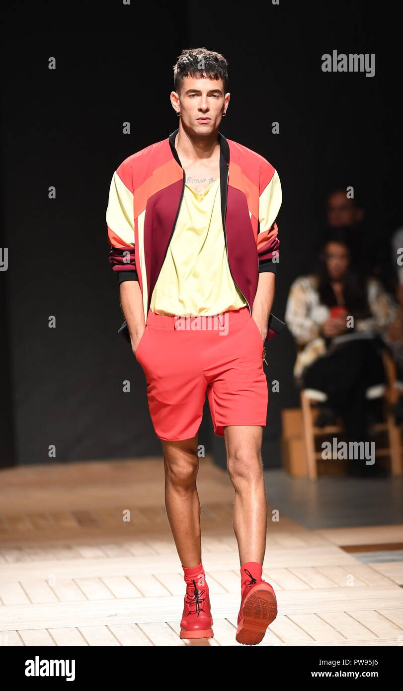 Lisbon, Portugal. 13th Oct, 2018. A model presents a creation of ...