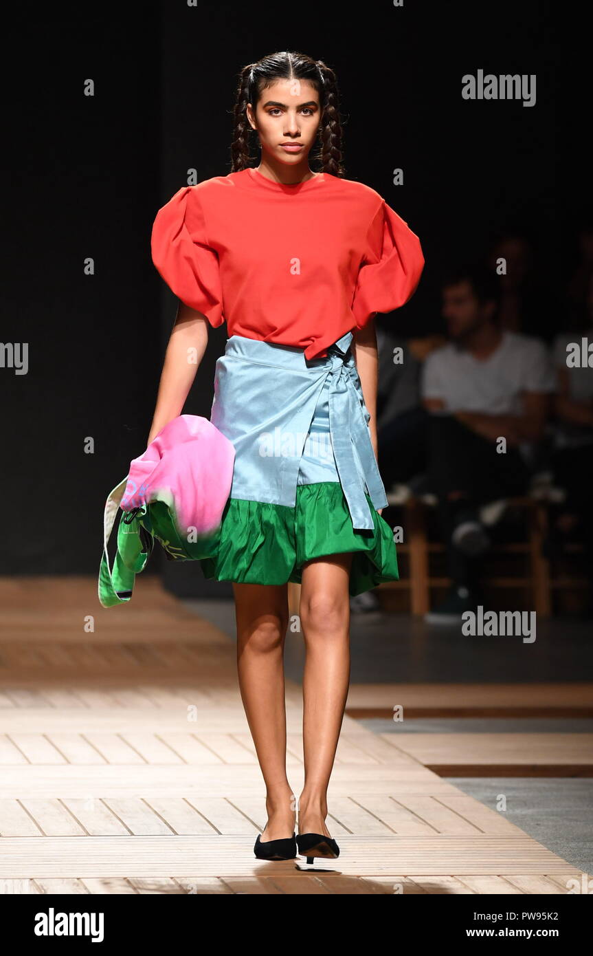 Lisbon, Portugal. 13th Oct, 2018. A model presents a creation of ...