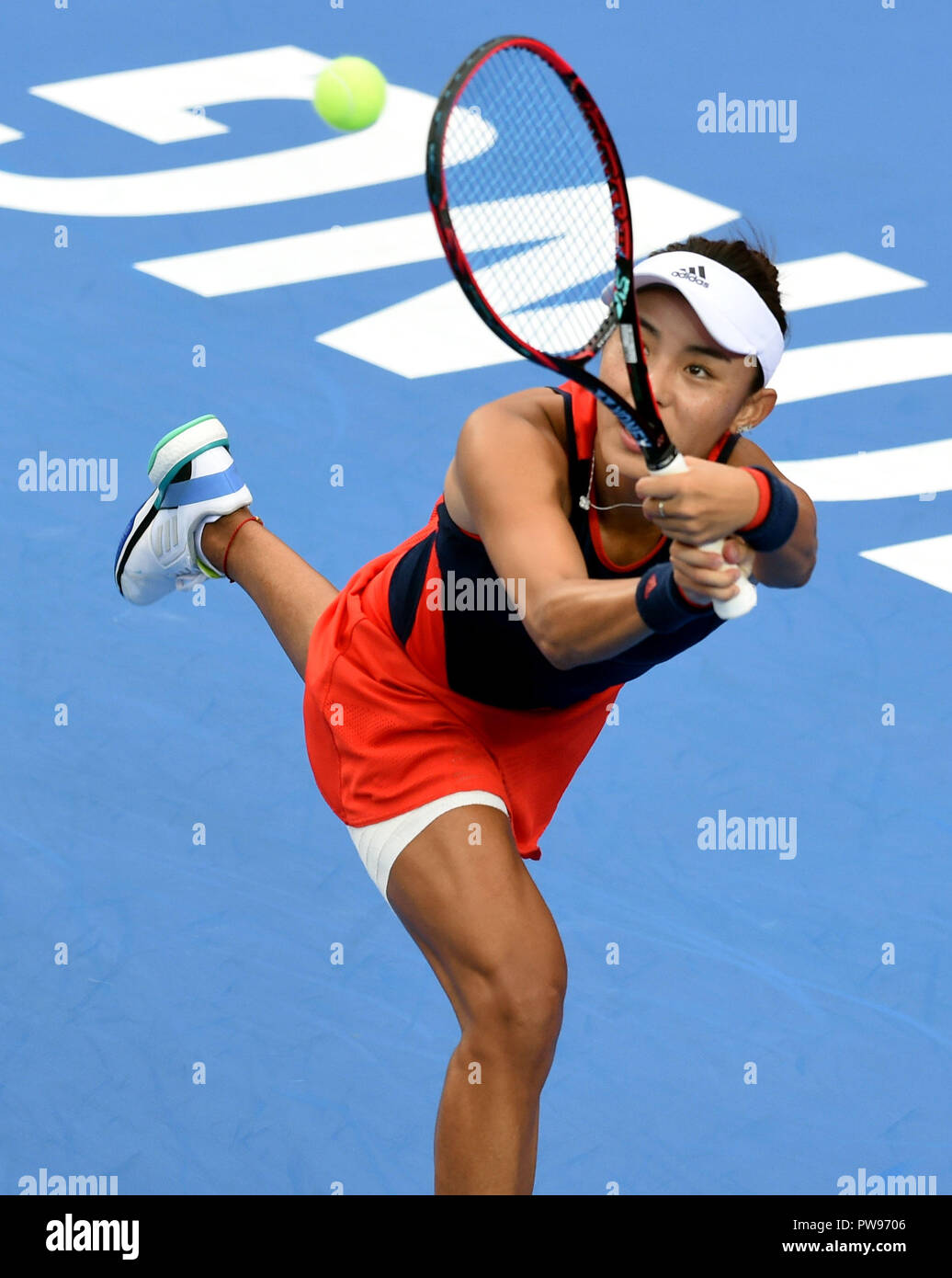 Hong Kong, China. 14th Oct, 2018. Wang Qiang of China hits a return ...