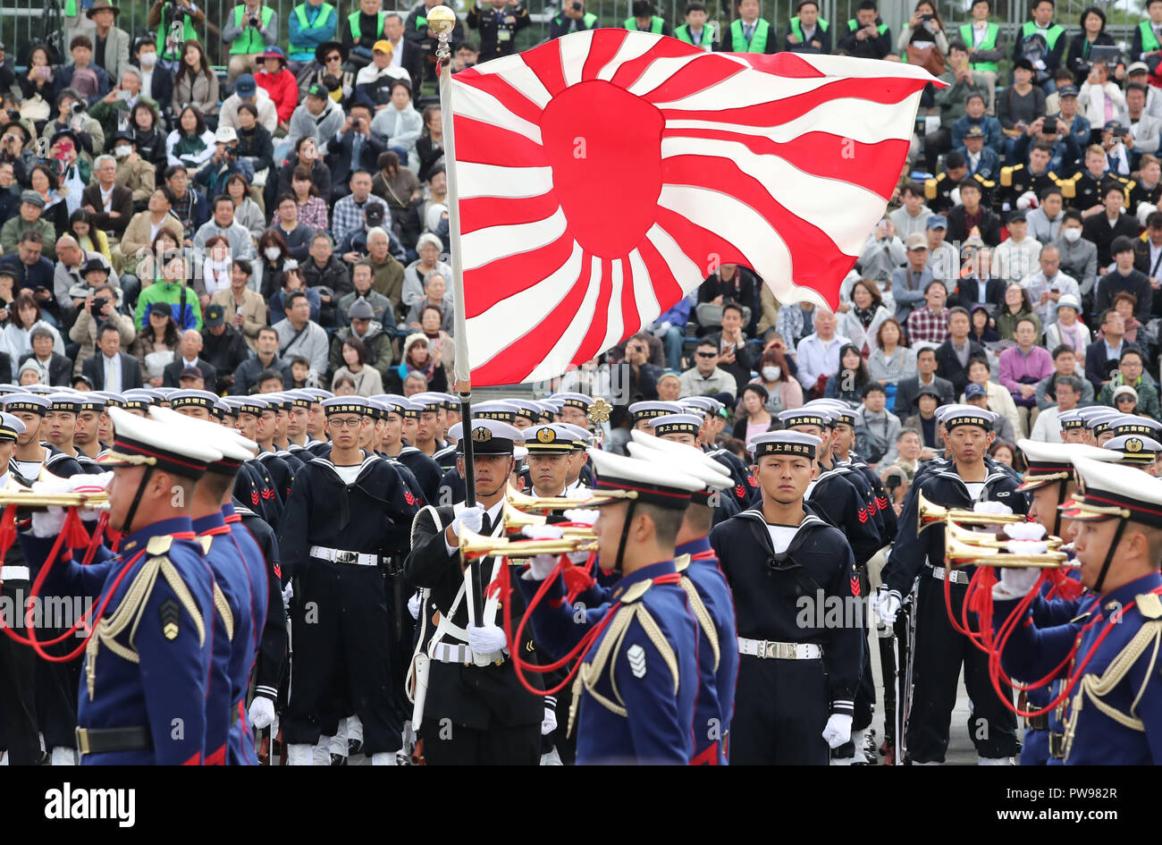 Asaka, Japan. 14th Oct, 2018. Members of the honor guards march before ...