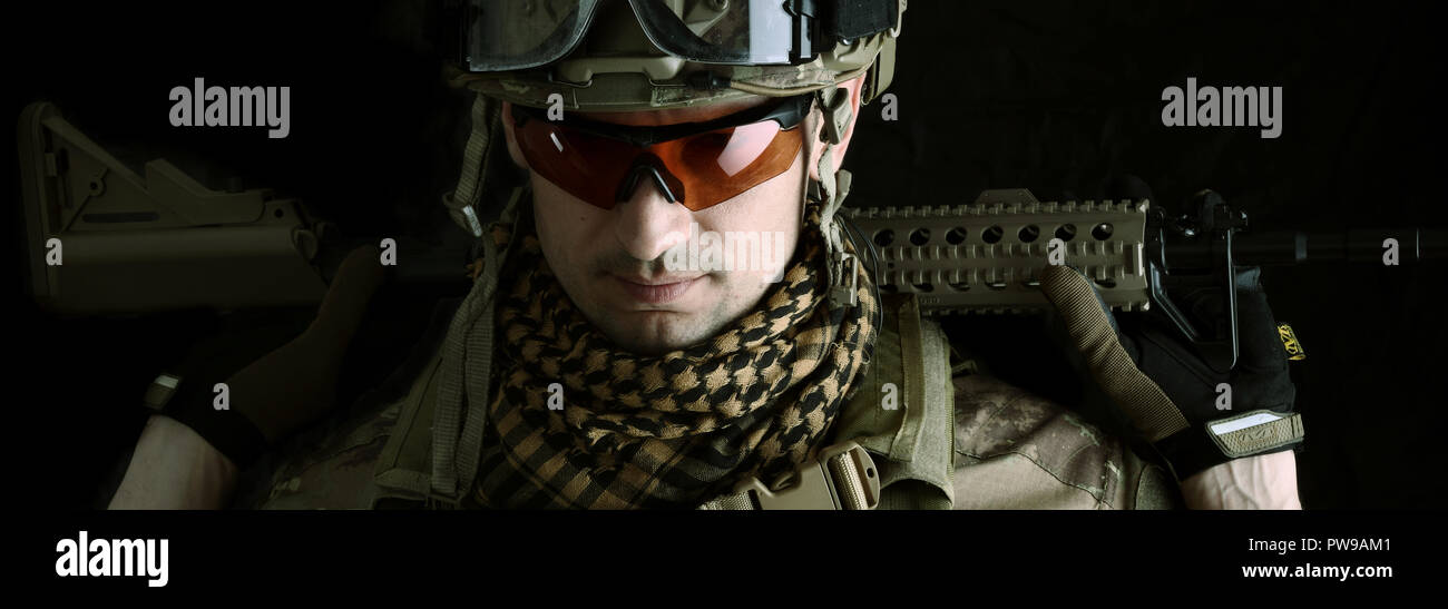 close up portrait of handsome military man. Macro shot on black ...