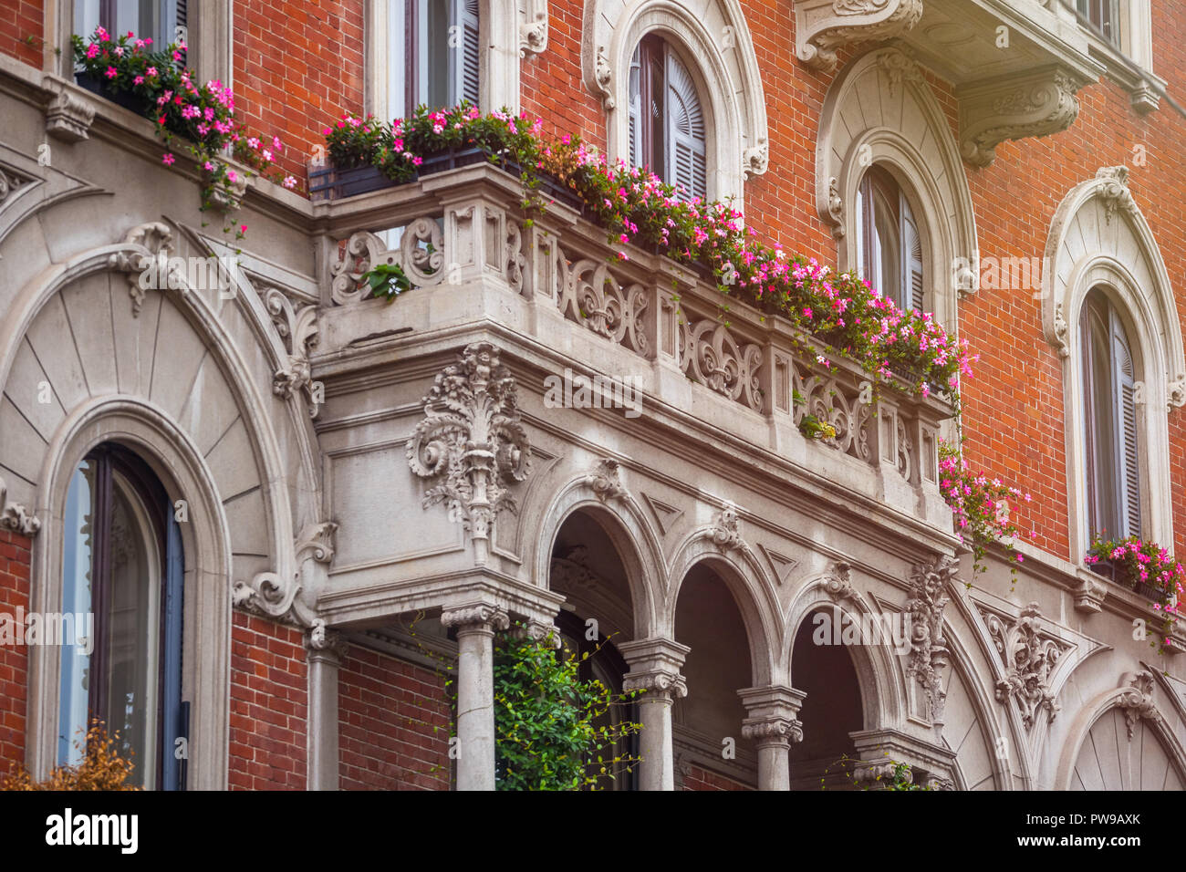 houses with flowers on the windows in Milan, Italy Stock Photo - Alamy