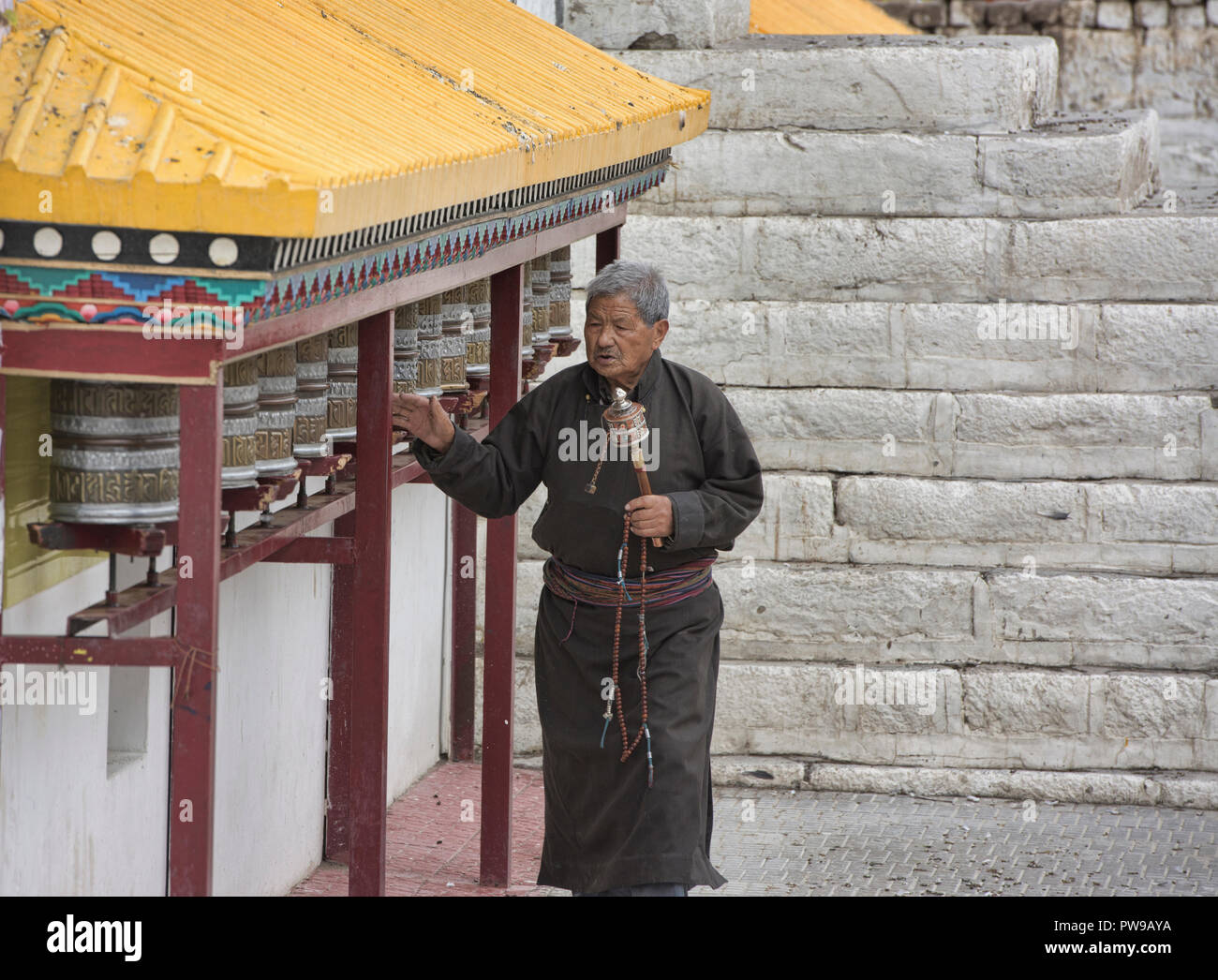 Ladakhi pilgrim spinning prayer wheels, Leh, Ladakh, India Stock Photo ...