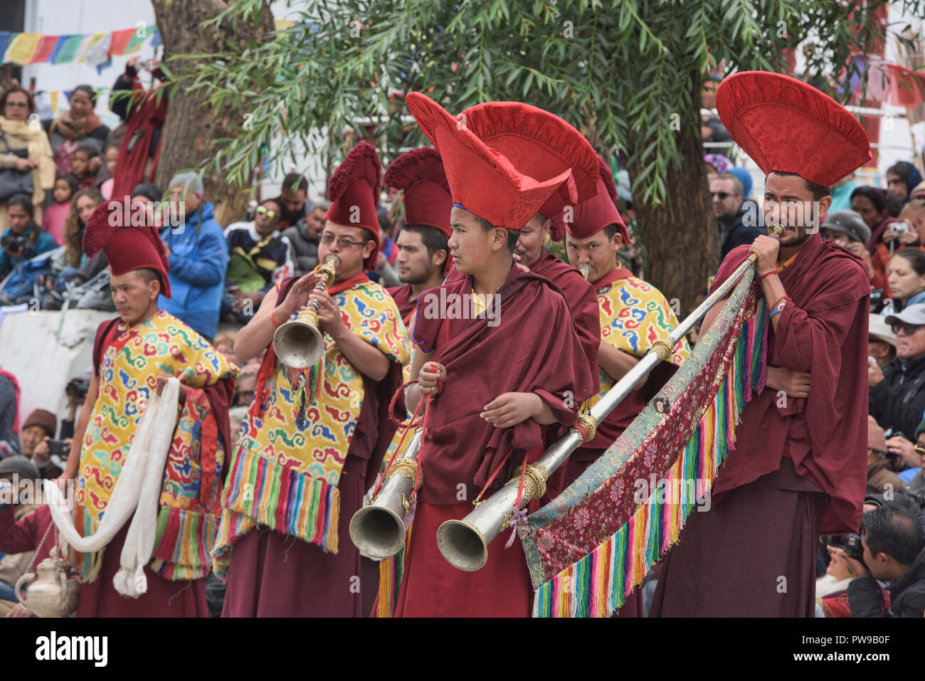 Red hat monks performing at a traditional Tibetan Buddhist Cham dance ...